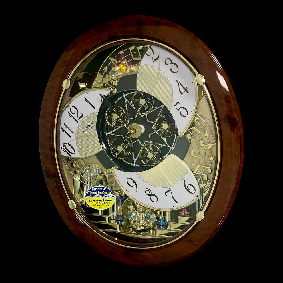 Rhythm "Woodgrain Stars" Moving Dial Magic Motion Musical Wall Clock ...