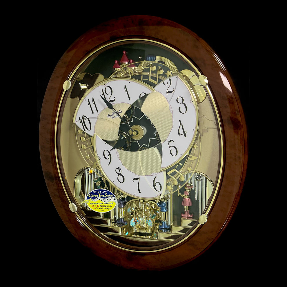 Rhythm "Woodgrain Stars" Moving Dial Magic Motion Musical Wall Clock ...