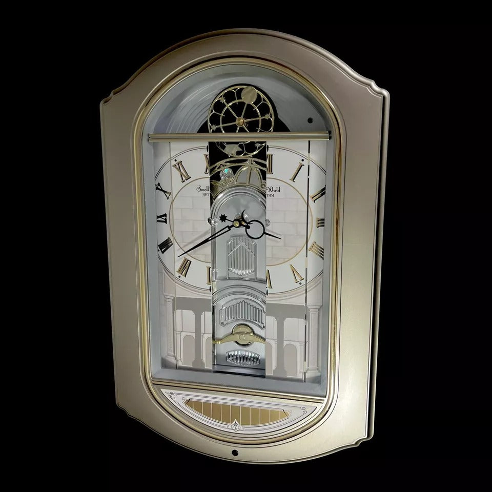 Rhythm “Renaissance” Magic Motion Musical Wall Clock with Moving Dial ...