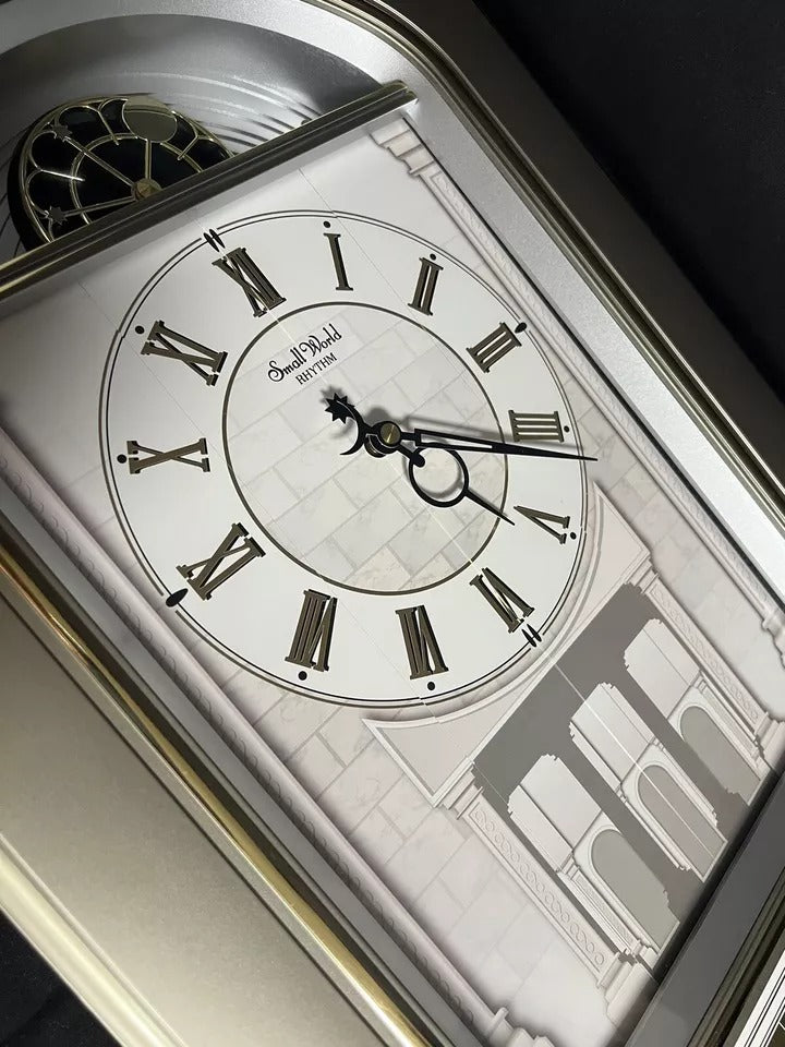 Rhythm “Renaissance” Magic Motion Musical Wall Clock with Moving Dial ...