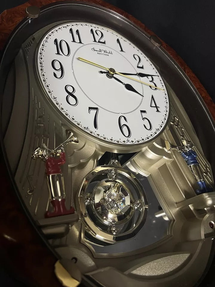 Rhythm "Trumpet Duet" Musical Motion Decorative Pendulum Wall Clock ...